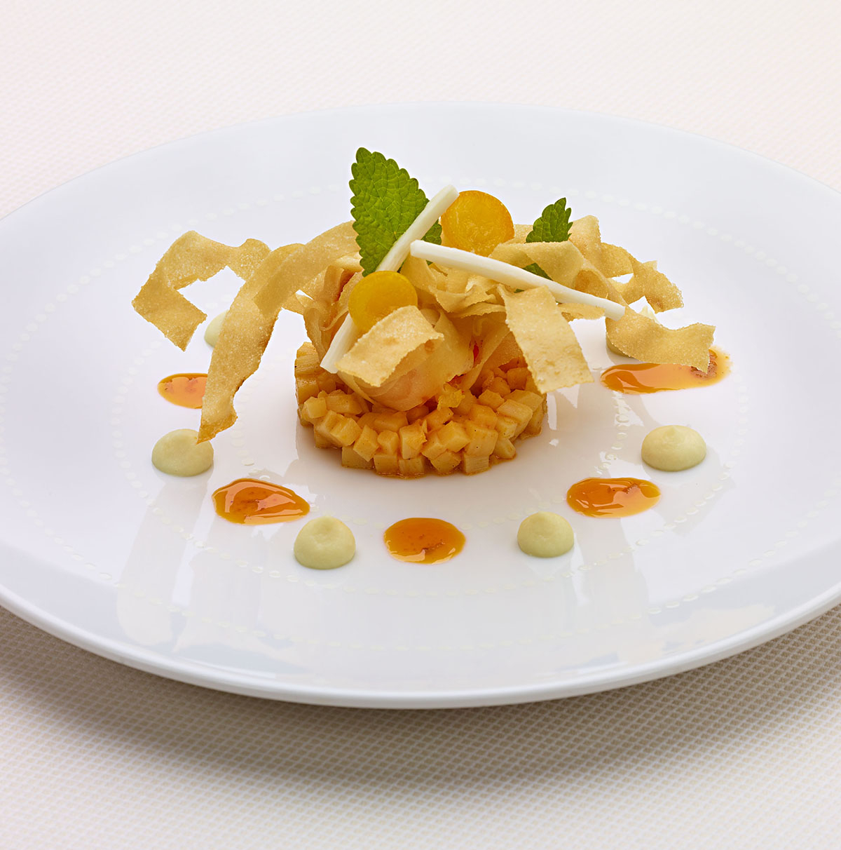 Langoustine croustillant with hearts of palm tandoori and pickled kumquat